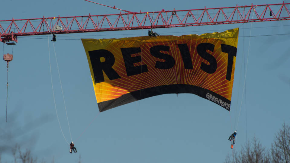Local Artist Arrested After Helping Hang 'Resist' Banner Near White ...
